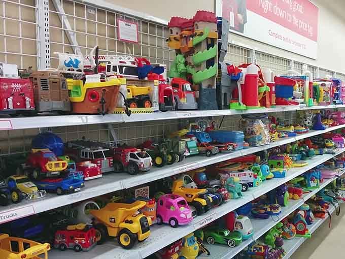 Colorful trucks and toys line up like a miniature traffic jam of childhood memories waiting for new adventures.
