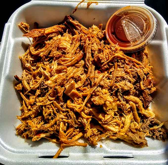 Pulled pork so tender it surrenders without a fight, each strand infused with hours of smoky love.