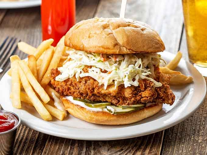 That golden fried chicken sandwich with crispy slaw looks like it could settle any argument peacefully and deliciously.
