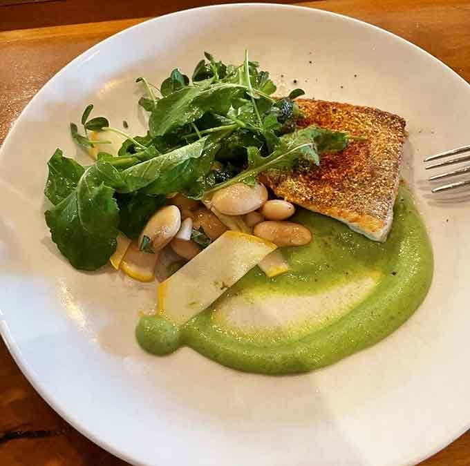 Walleye perched on zucchini puree like it's posing for its album cover, and honestly, it's earned that confidence.