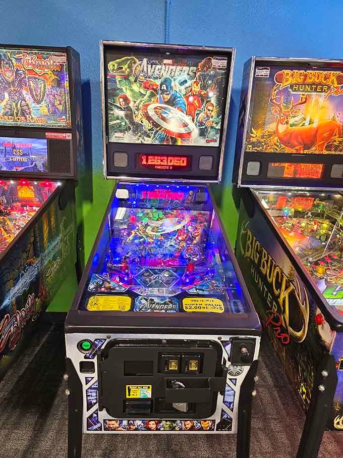 The Avengers pinball machine stands ready to test your reflexes while you wait for your pizza to arrive.