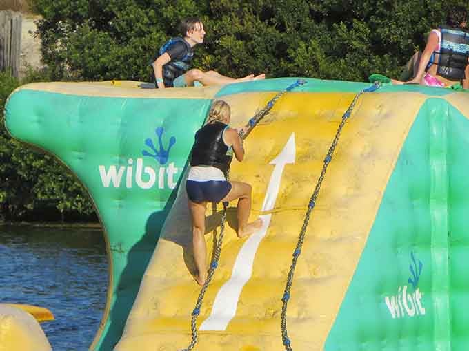 That climbing wall with chains looks innocent enough until you're halfway up questioning your life choices.