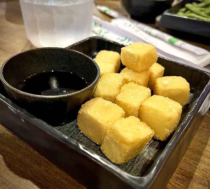 Golden fried tofu cubes that prove sometimes the simplest things in life are worth celebrating with chopsticks.