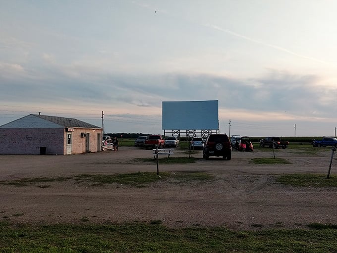 The concession stand awaits while families claim their spots for an evening of double-feature entertainment and memories.