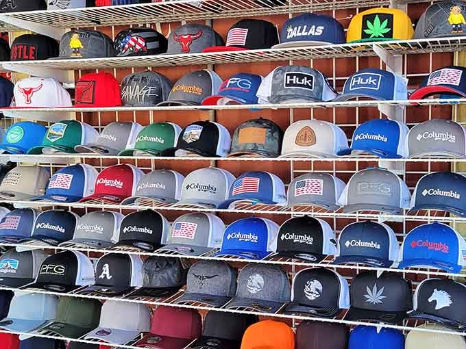 Baseball caps stacked like a rainbow of team loyalties &ndash; find your tribe or start a new one.