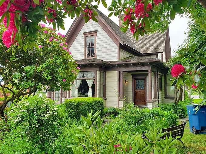 Victorian architecture surrounded by blooming rhododendrons creates the kind of scene that makes your camera roll very, very happy.