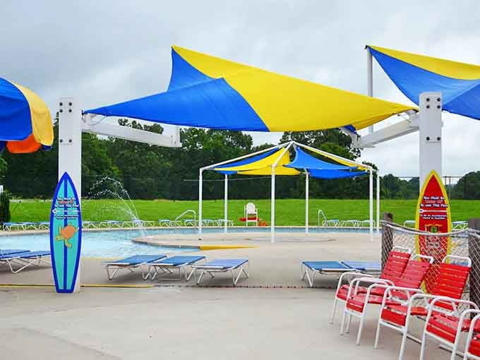 Beach-themed shade structures and surfboard decorations bring coastal vibes to landlocked Kentucky with surprising authenticity.