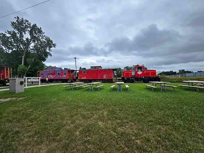 Those picnic tables and colorful cabooses create the perfect spot for families to gather before their journey begins.