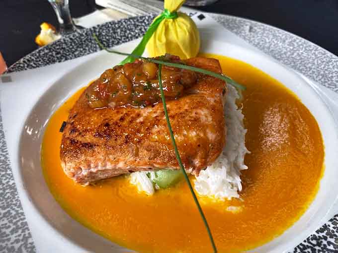Norwegian salmon swimming in a golden sauce that looks like liquid sunshine decided to become dinner.
