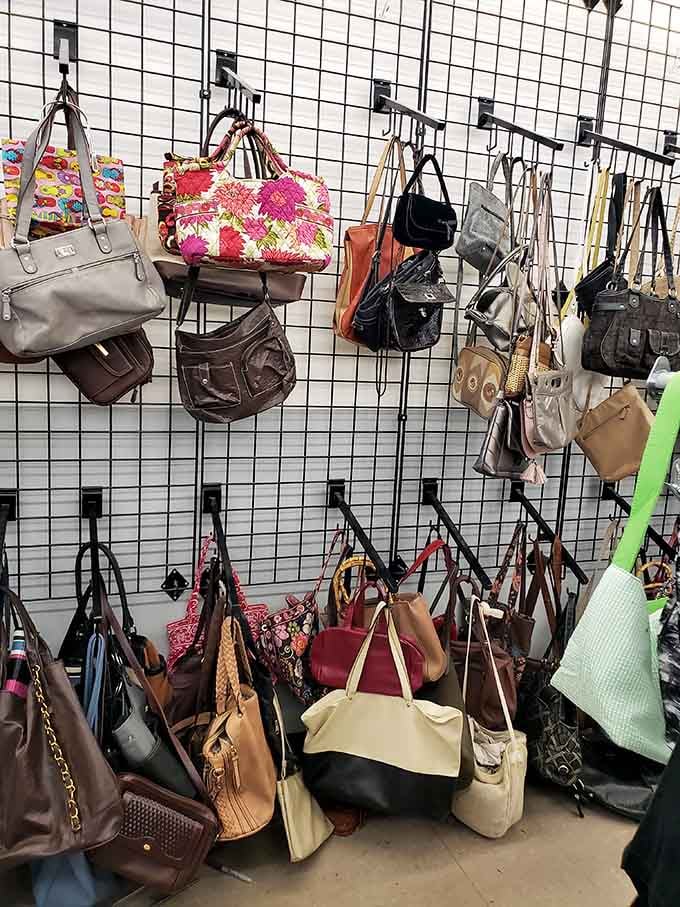 Purses hanging like a wall of possibilities, each one potentially hiding that perfect everyday bag you've been searching for.