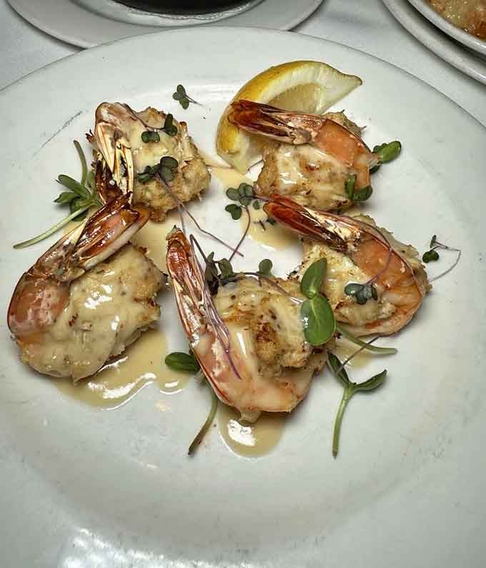 Crab-stuffed shrimp with that golden finish is basically surf and surf, doubling down on oceanic excellence in one brilliant dish.