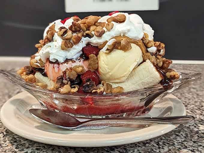 This banana split towers like a delicious monument to excess, proving that sometimes more really is more, gloriously more.