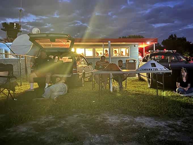 Dusk settles over the lot as families claim their spots for an evening of entertainment.