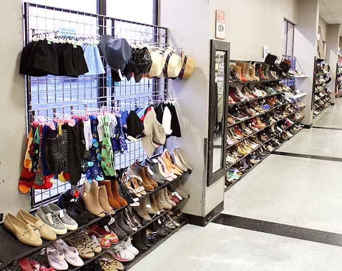 Shoes and accessories organized better than some department stores, proving thrift doesn't mean chaos.