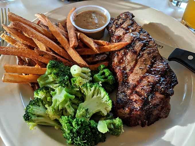 Broccoli never looked so good next to a perfectly charred steak and crispy golden fries.