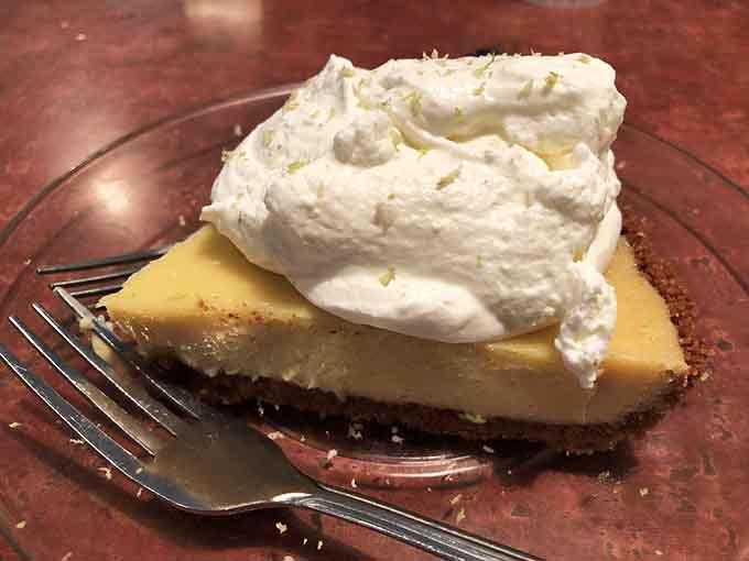 Key lime pie with whipped cream piled high enough to require architectural support&mdash;Florida's gift to dessert lovers.