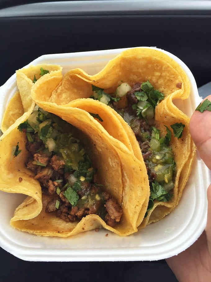 Soft tortillas embrace tender barbacoa in this handheld masterpiece that demands your immediate attention and appetite.