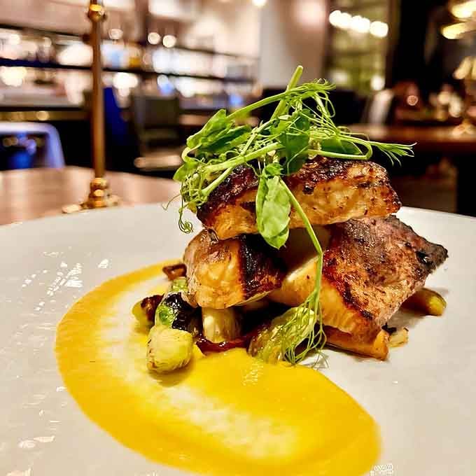 This black cod sits pretty on its throne of vegetables, looking like it just won best in show at the seafood Olympics.