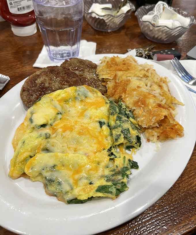 That spinach omelet looks like it absorbed an entire farmer's market and came out absolutely glorious.
