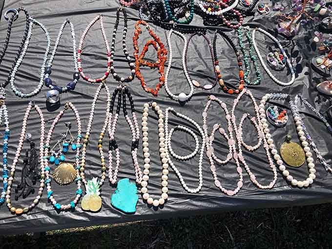 Beaded treasures sprawl across tables like a pirate's bounty, each necklace telling its own colorful story.