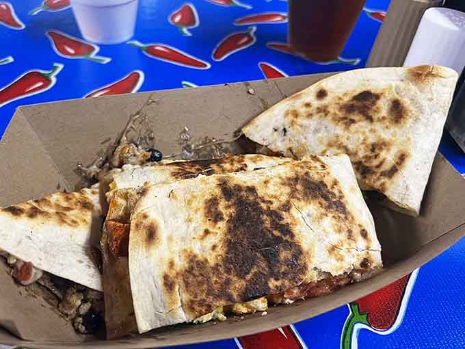That quesadilla got grilled until it achieved the perfect golden-brown crispiness that makes cheese-lovers weep with pure joy.