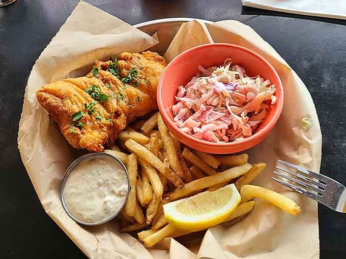 Golden fish and chips with a side of slaw: proof that simple done right beats complicated every time.