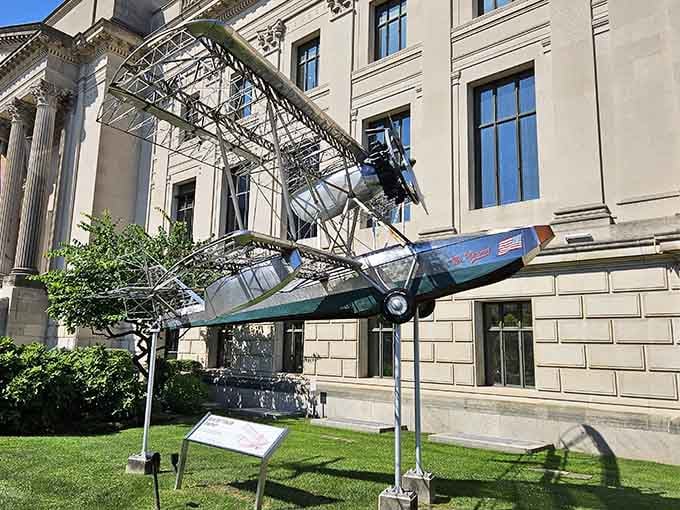 A vintage aircraft doing acrobatics outside a science museum&mdash;Philadelphia's way of making physics look impossibly cool.