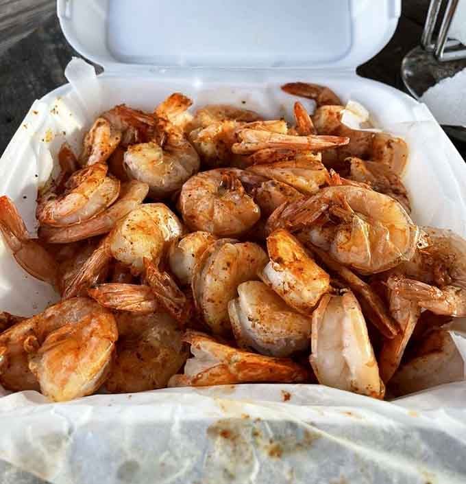 Perfectly seasoned steamed shrimp by the pound, glistening and ready to disappear faster than your willpower can handle.