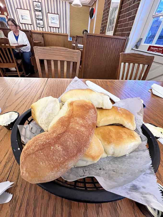 Fresh bread arriving at your table warm and golden, because sometimes the simple pleasures are the most satisfying ones.