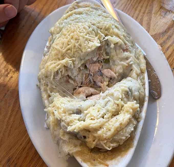The seafood pie looks like comfort decided to take a swim and came back delicious.
