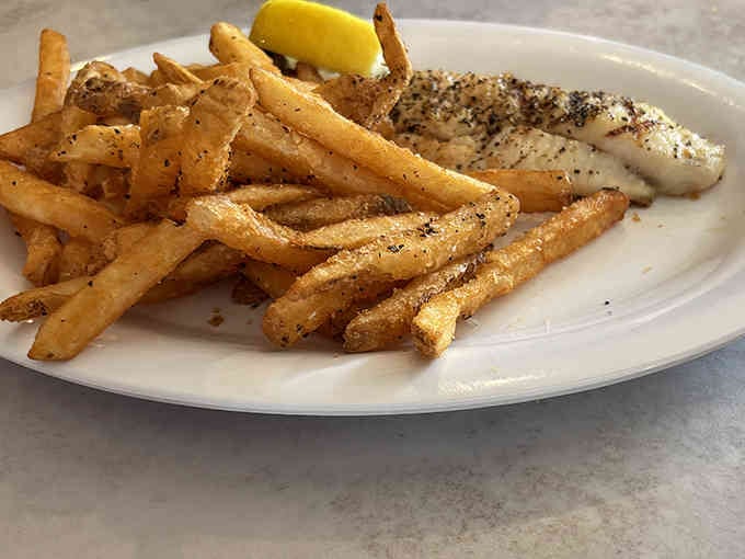 Grilled fish proves The Ketch can do subtle elegance too, with Old Bay fries stealing the spotlight.