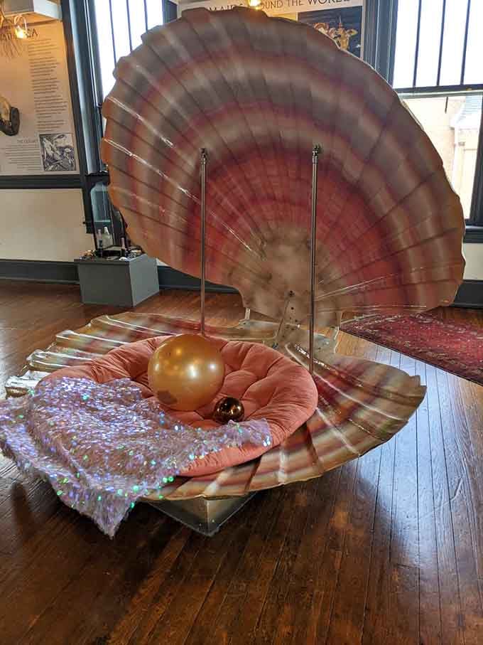 This giant clamshell with its golden pearl is basically the ocean's way of showing off, and we're not mad about it.