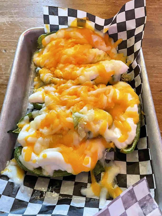 Jalape&ntilde;o poppers stuffed with cheese and smothered in more cheese, because subtlety is overrated when it's this delicious.