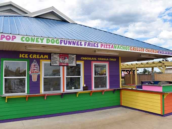 Funnel fries, pizza, and ice cream fuel your waterpark adventures from this vibrant concession stand of delicious possibilities.