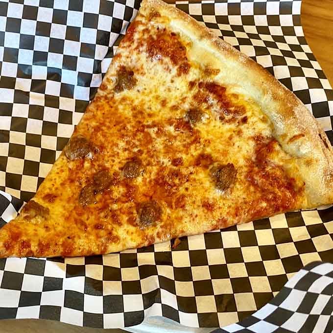 Golden, bubbly cheese on this sausage slice achieves that perfect pizza nirvana we all chase but rarely find.