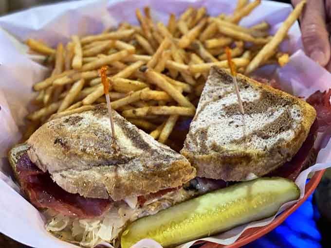 The Reuben arrives with enough fries to share, though let's be honest, you probably won't.
