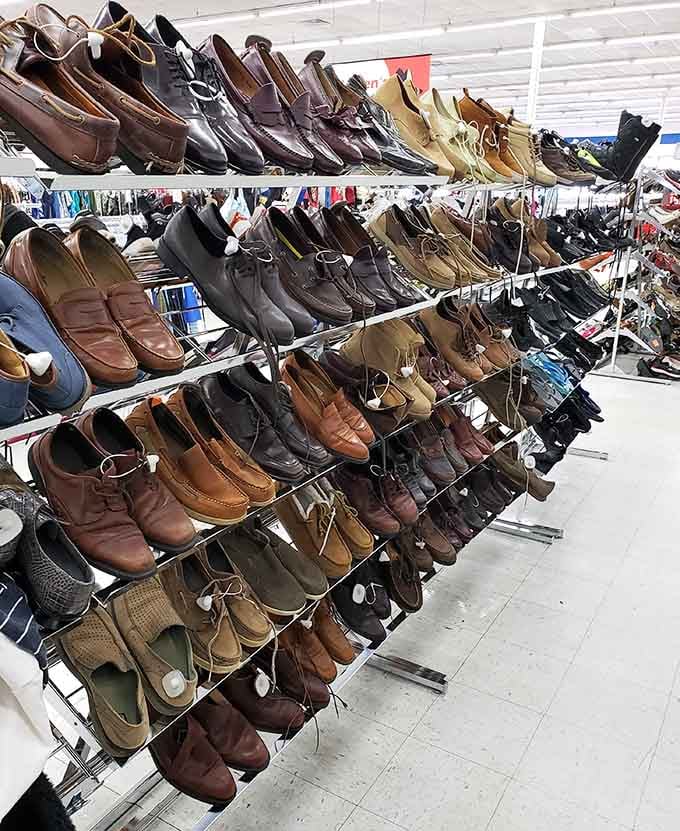 Rows of men's shoes standing at attention, ready to walk miles in someone else's footsteps literally.