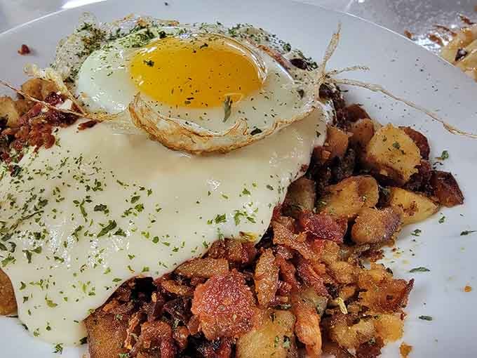 When your hash gets topped with a perfectly fried egg and melted cheese, you've officially reached breakfast nirvana, friends.