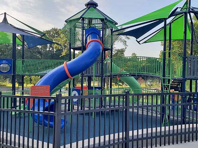 Tube slides twist through this playground like colorful roller coasters designed by someone who actually likes children.