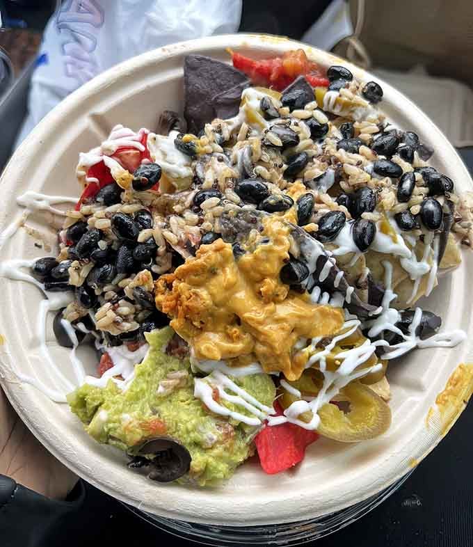 These loaded nachos come piled so high, you'll need a strategic game plan before diving in headfirst.