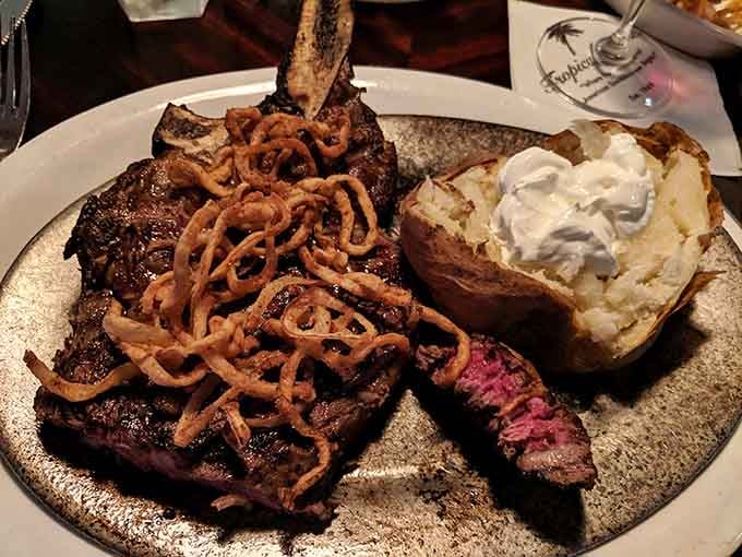 The Cowboy Ribeye arrives like it's ready for its close-up, complete with crispy onions and carbs.