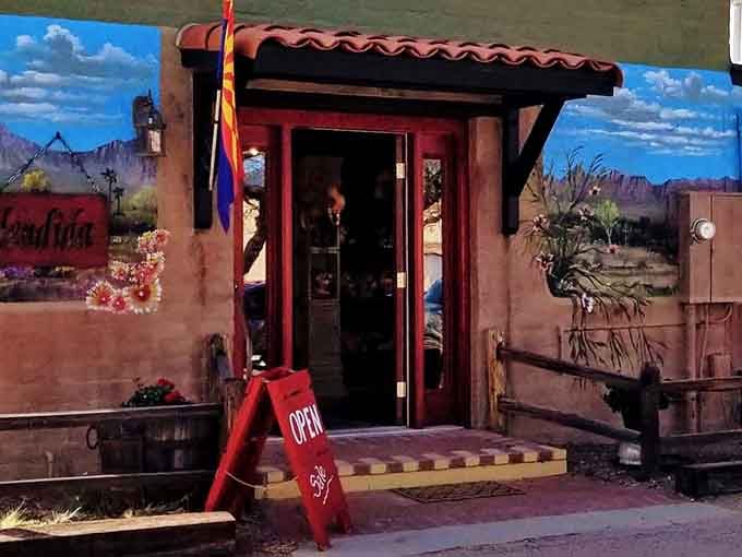 That painted desert mural and welcoming doorway practically beg you to step inside and explore.