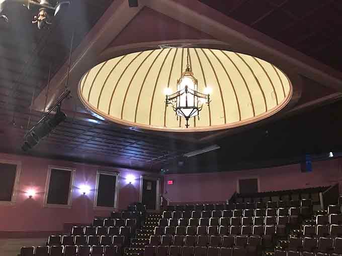 That dome ceiling catches light like a crown jewel, illuminating performances with old-world elegance and charm.