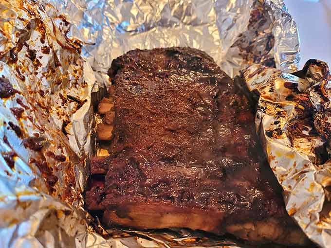 When ribs look this perfect, you know someone spent hours tending the smoker with serious dedication and love.