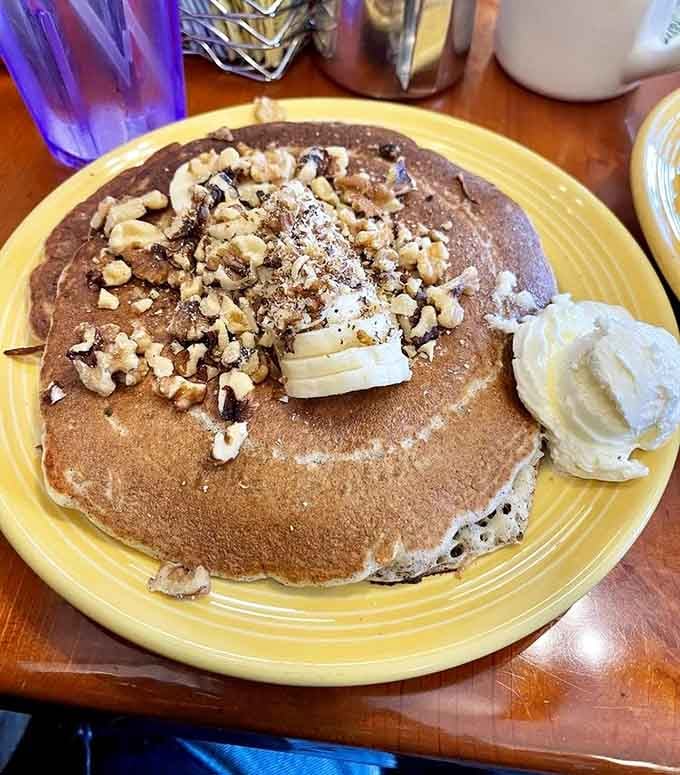 Chocolate chip pancakes topped with walnuts and powdered sugar, because sometimes you need dessert for breakfast and that's perfectly acceptable.