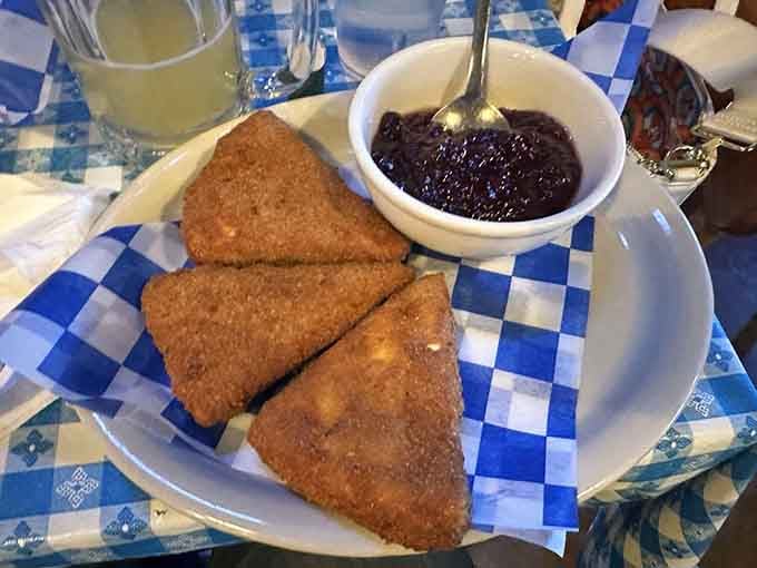 Fried brie with cranberry sauce proves that sometimes the best cultural exchanges happen through melted cheese and fruit.