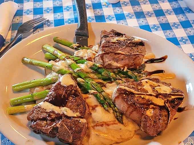 Perfectly grilled lamb chops with asparagus show that German restaurants can handle elegant presentations with ease.
