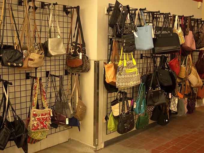 Purses, totes, and handbags displayed like a boutique, proving thrift shopping doesn't mean sacrificing style or selection.
