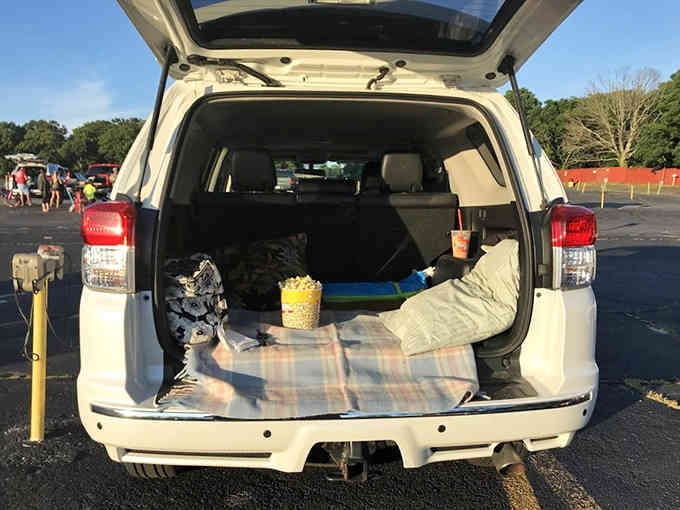 Trunk setup goals: blankets, pillows, popcorn, and the kind of planning that would make Martha Stewart jealous.