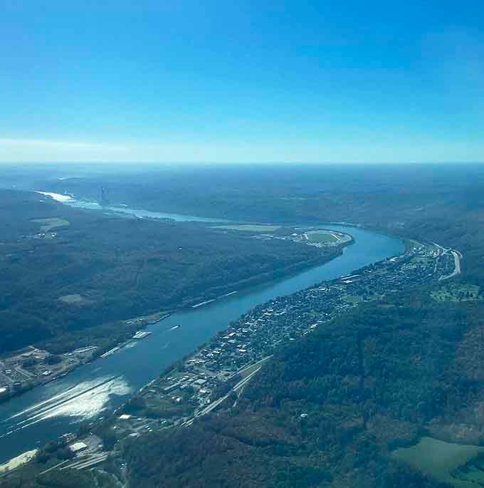 The Ohio River winds through town like nature's own highway, providing free entertainment since long before streaming services.